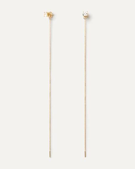 Pendientes largos + pelo recogido, el match perfecto y los 12 ...